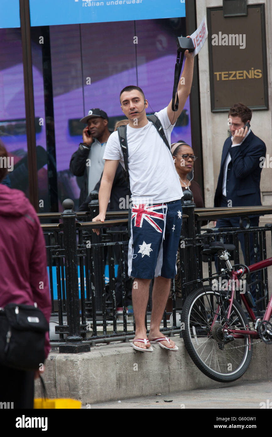 Religious preacher with Jesus poster preaching in Oxford Street London ...
