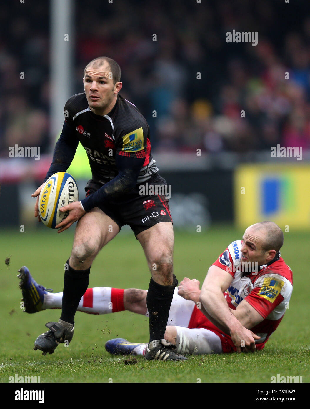 London Welsh Gordon Ross eludes Gloucester's Charlie Sharples during ...