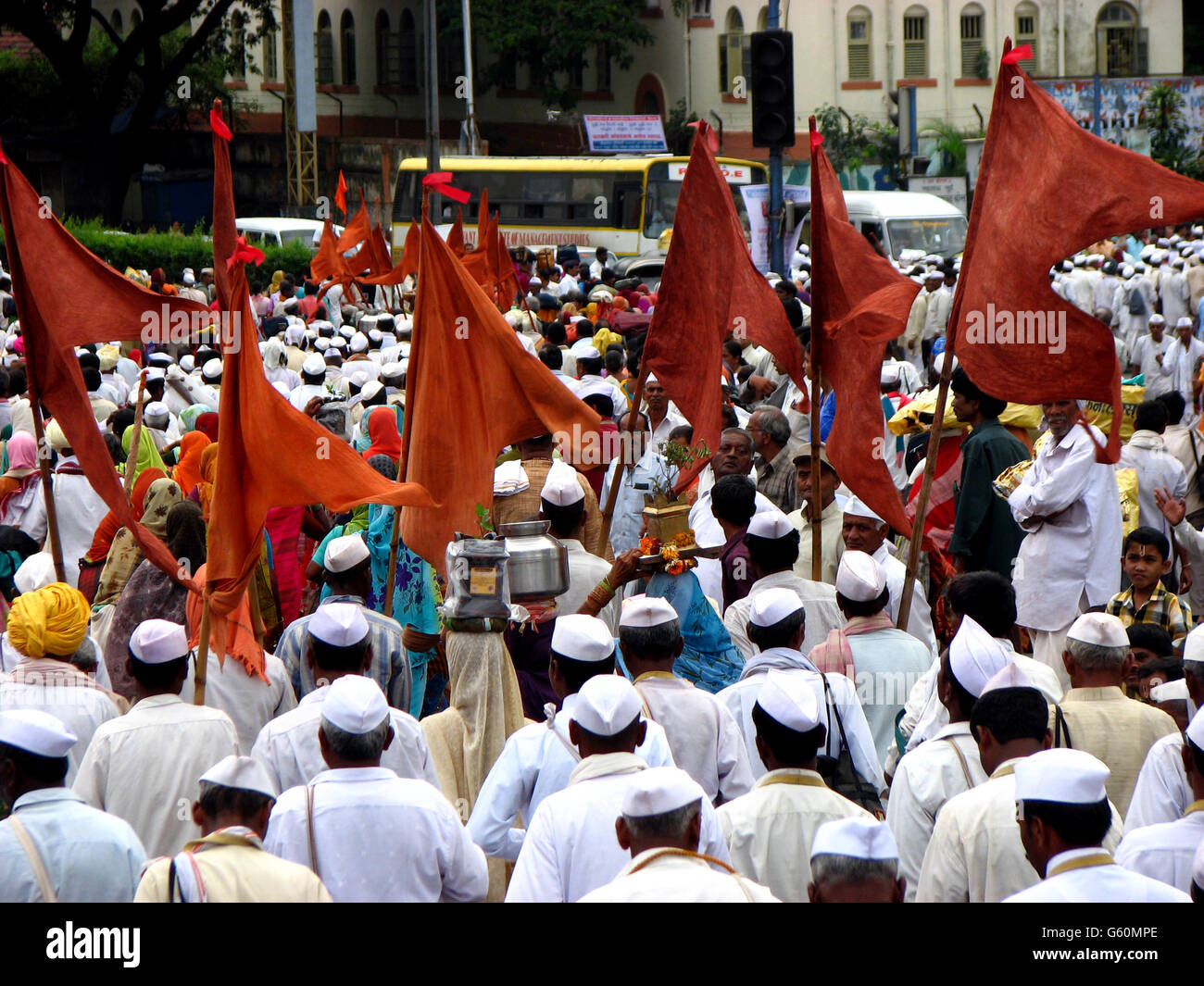 Hindu Pilgrims walking with their flags through the city of Pune-India ...