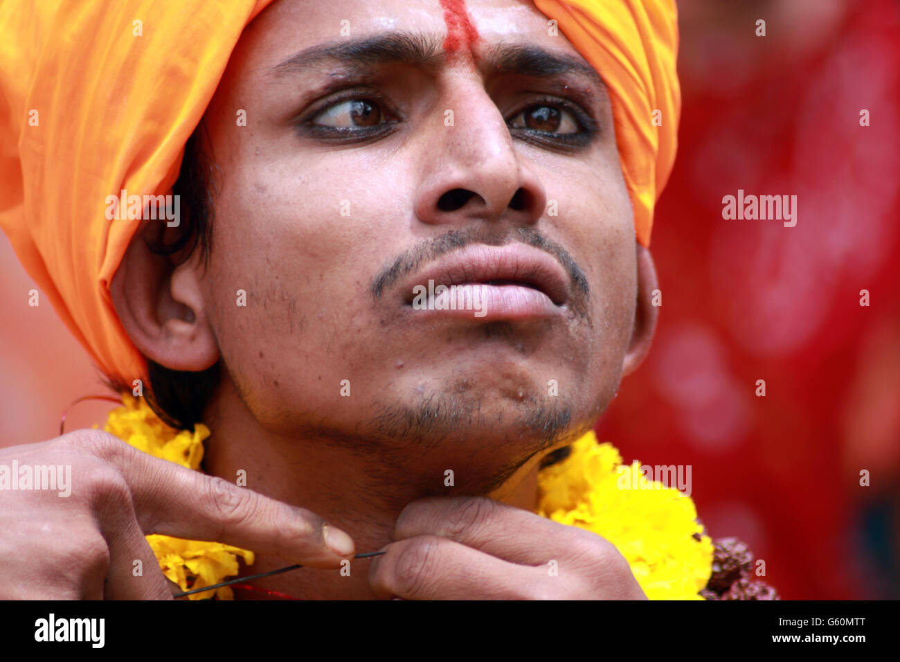 A closeup view of the painful expression of a tribal Indian man ...