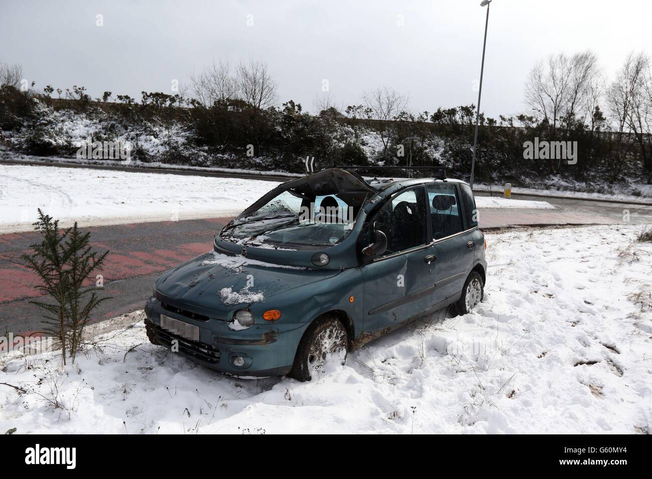 NUMBER PLATE PIXELATED BY PA PICTURE DESK A car is left after a crash ...