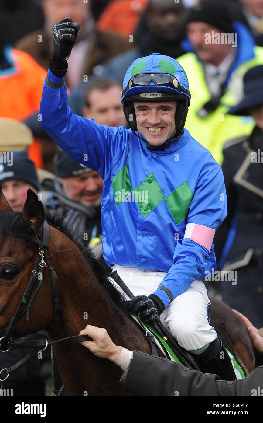 Hurricane Fly and jockey Ruby Walsh celebrate winning the Stan James ...