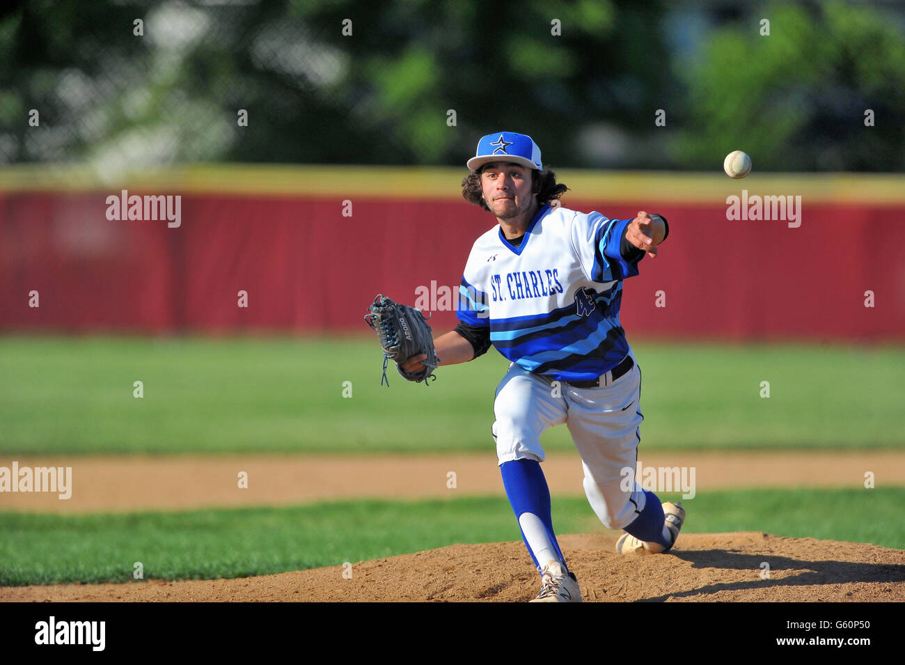 Left-handed pitcher delivering a pitch to a waiting hitter during a ...