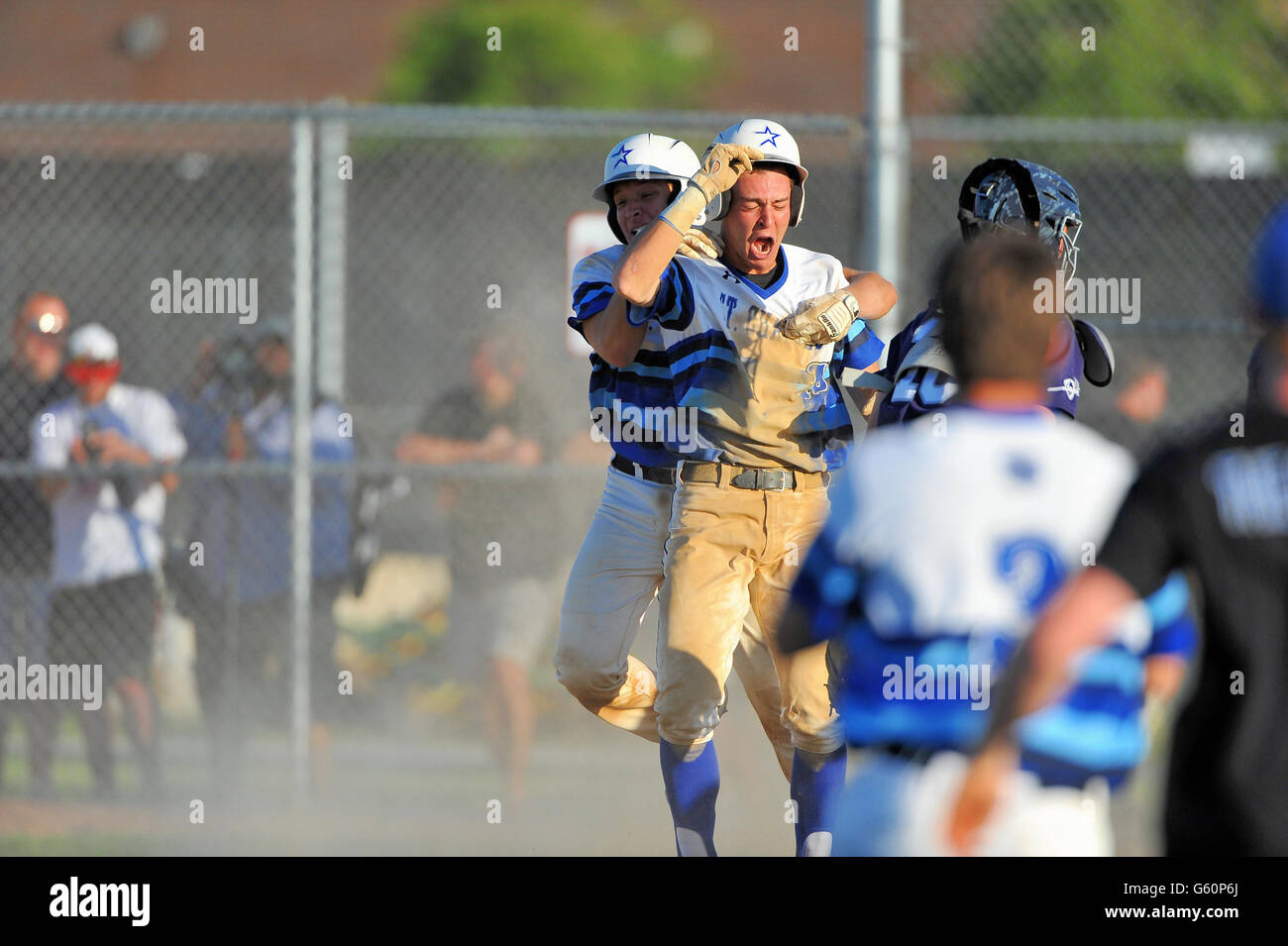 Player begins celebrating with his teammate after scoring the winning ...