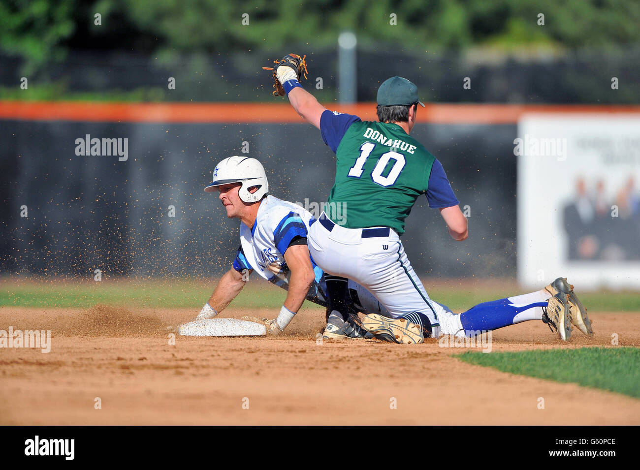 Base runner dives in safely to second base with a successful steal ...