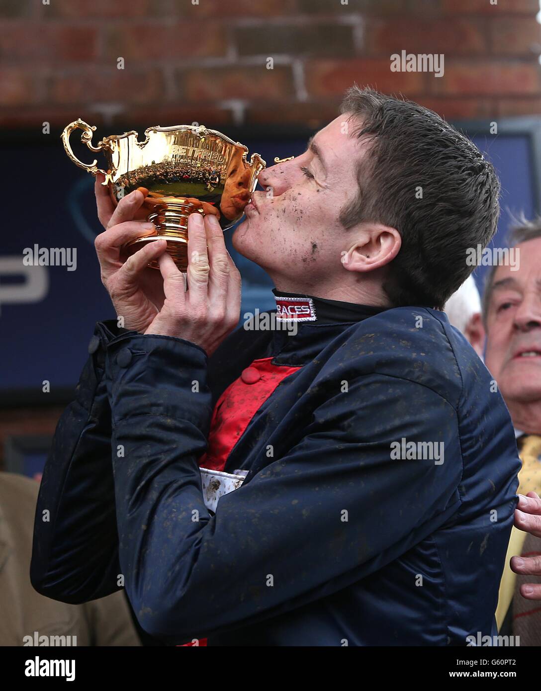 Winning Jockey Barry Geraghty kisses his trophy after winning the ...