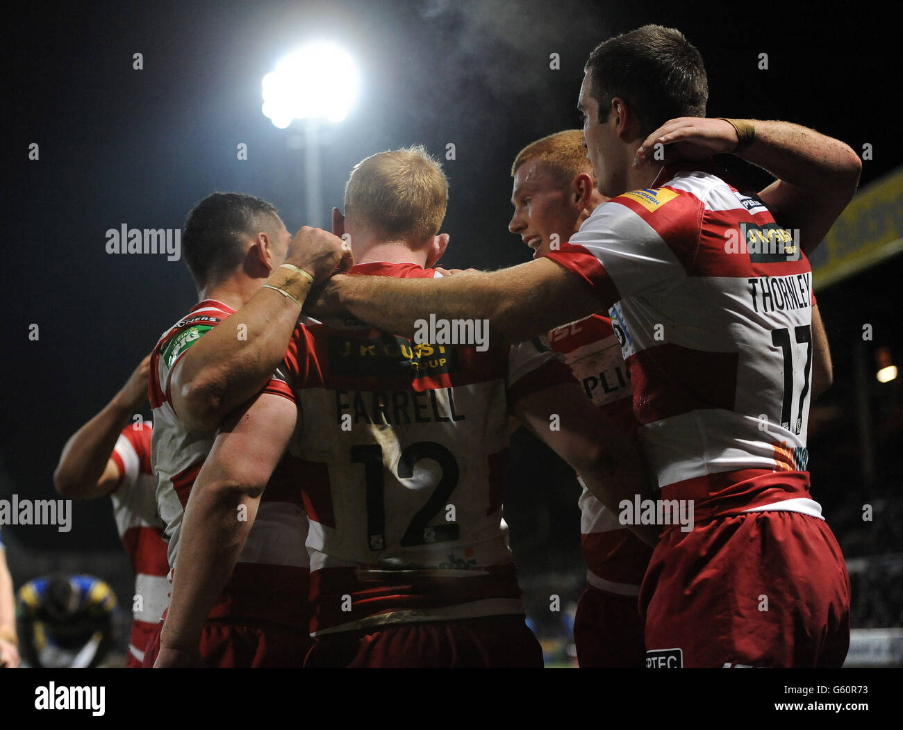 Wigan Warriors Liam Farrell (centre) celebrates his try with teammates ...