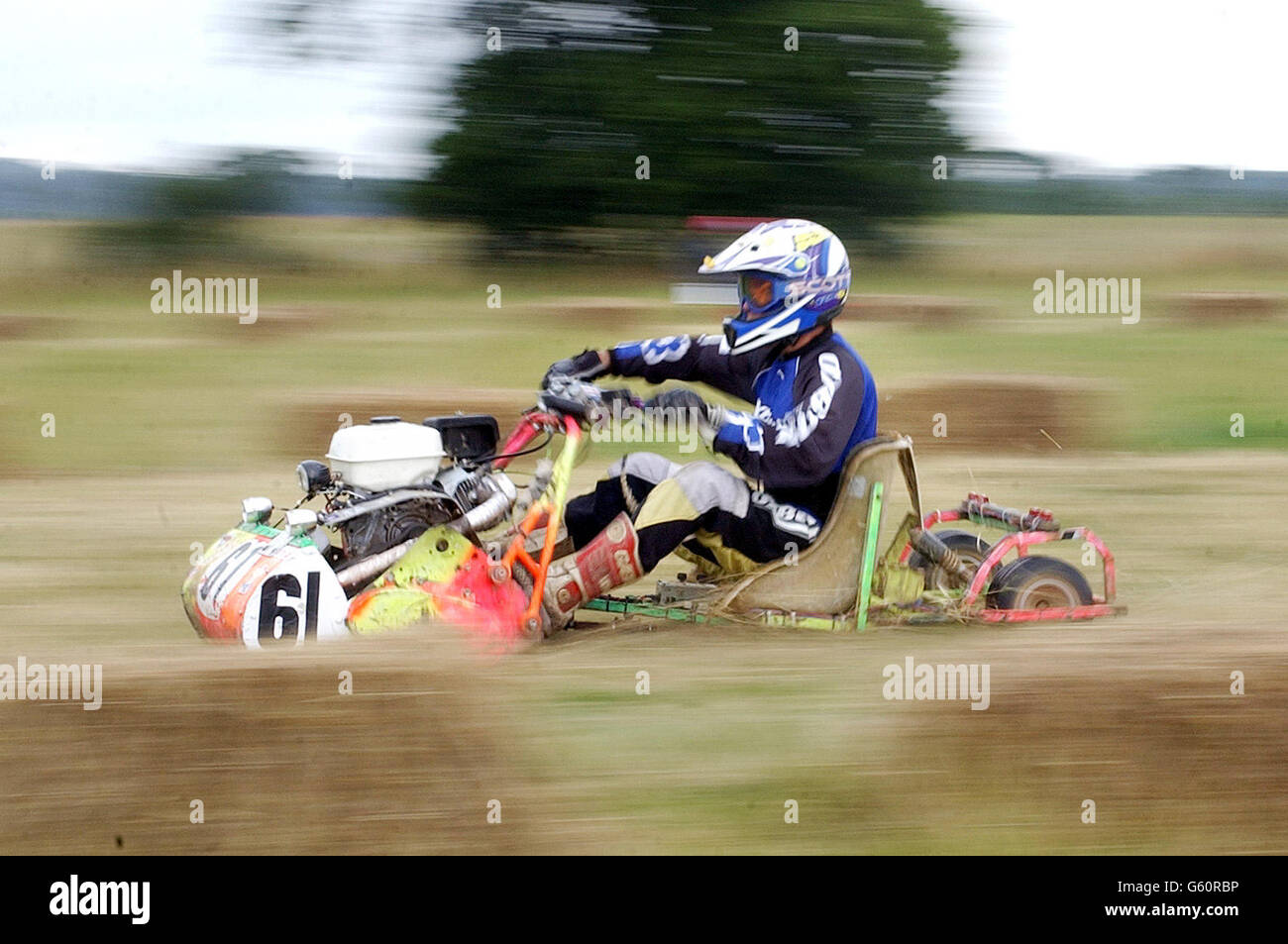 Competitor Team Cheesy Helmets (61) on an Atco mower in practice for ...
