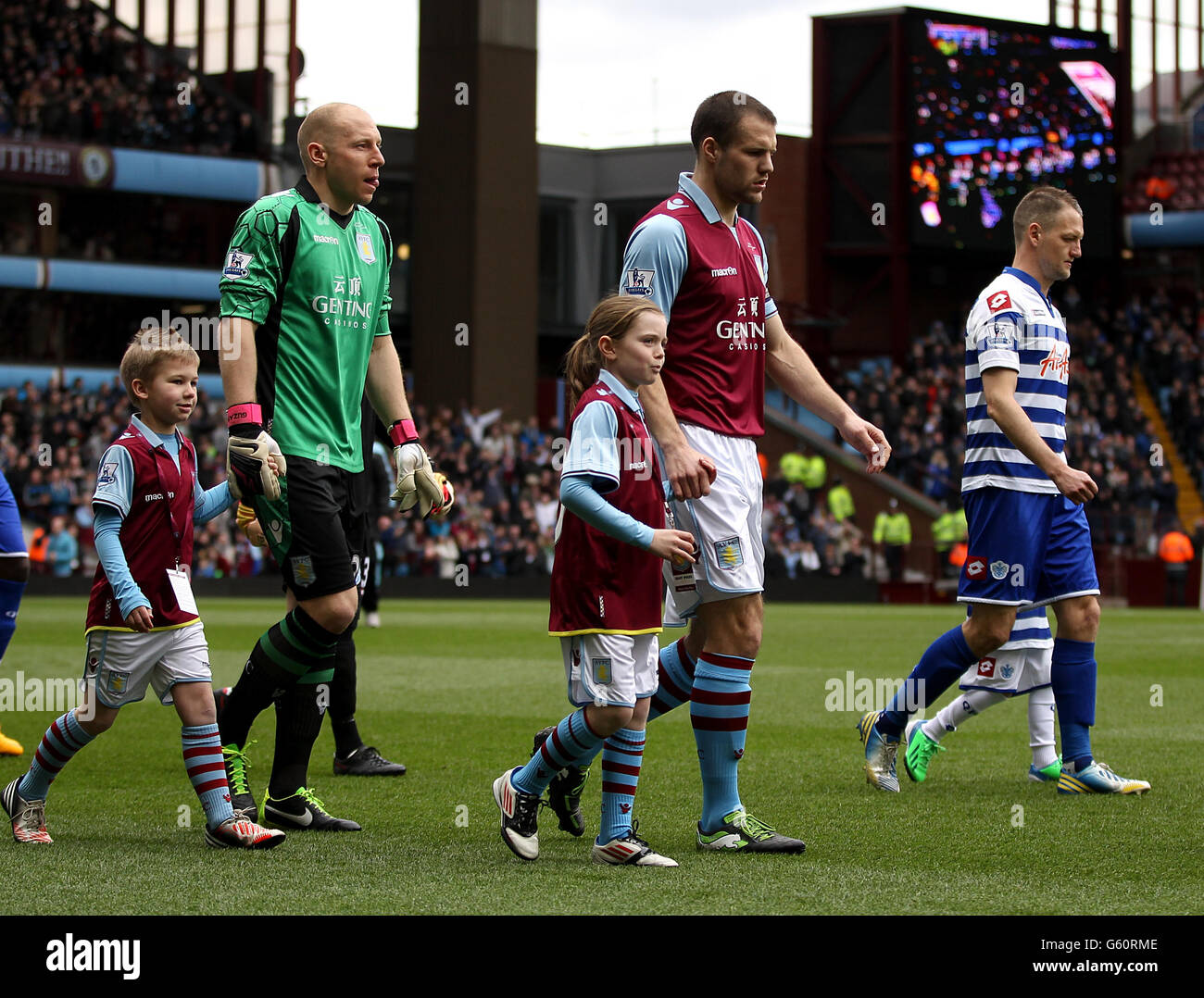 Aston villas captain ron vlaar right leads his team hi-res stock ...