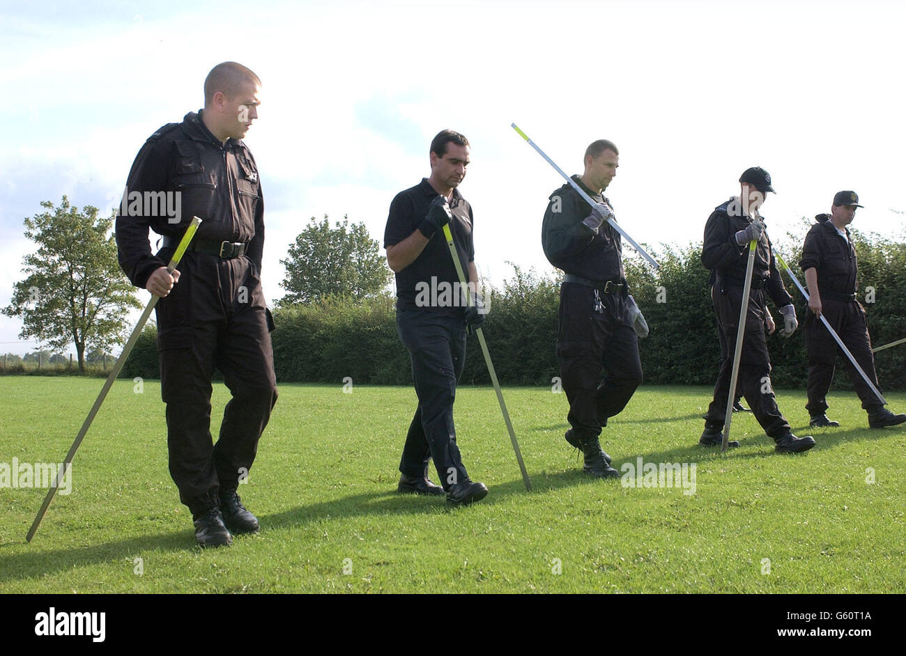 A Police search team scan for clues about the missing 10-year-olds ...