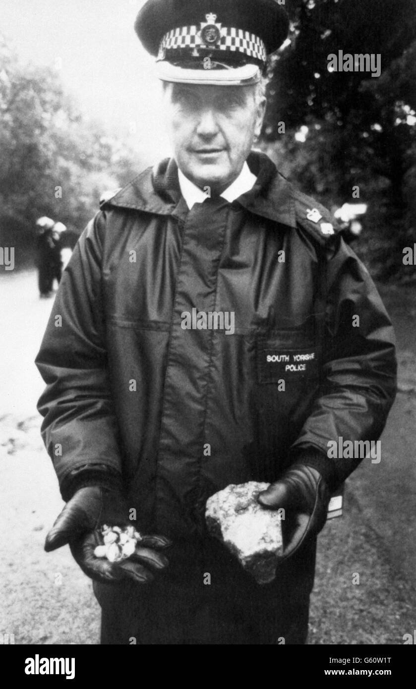 Chief Supt. John Nesbit, of the South Yorkshire Police, shows some of ...