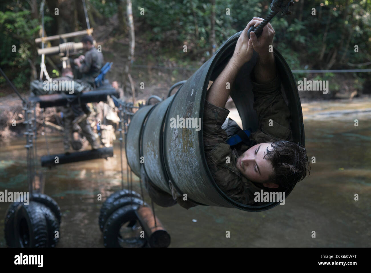 U.S. Army soldiers with the 82nd Infantry Division crawl through ...