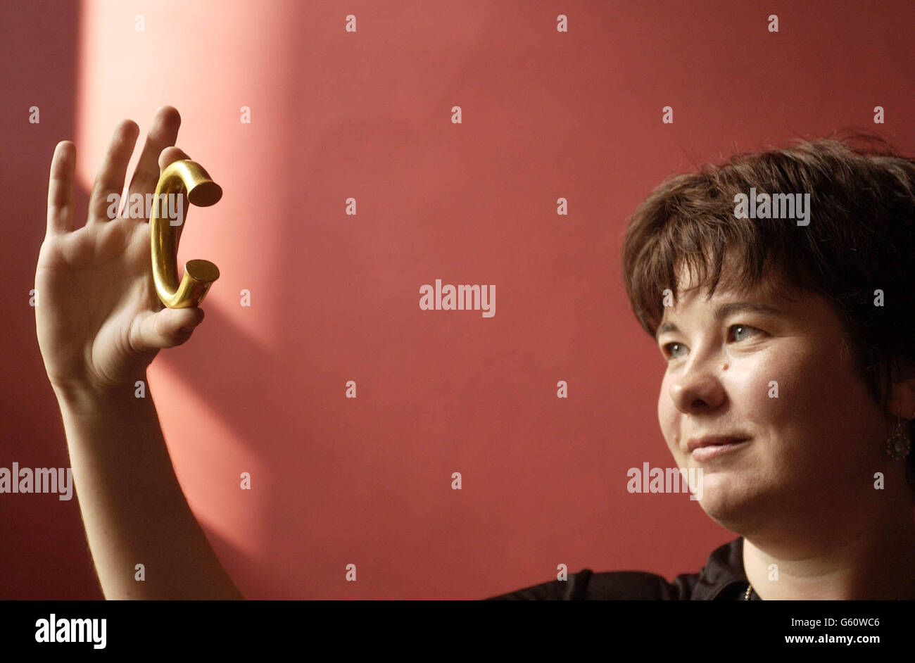 Pam Young of the British Museum, displays an iron age gold bracelet at ...