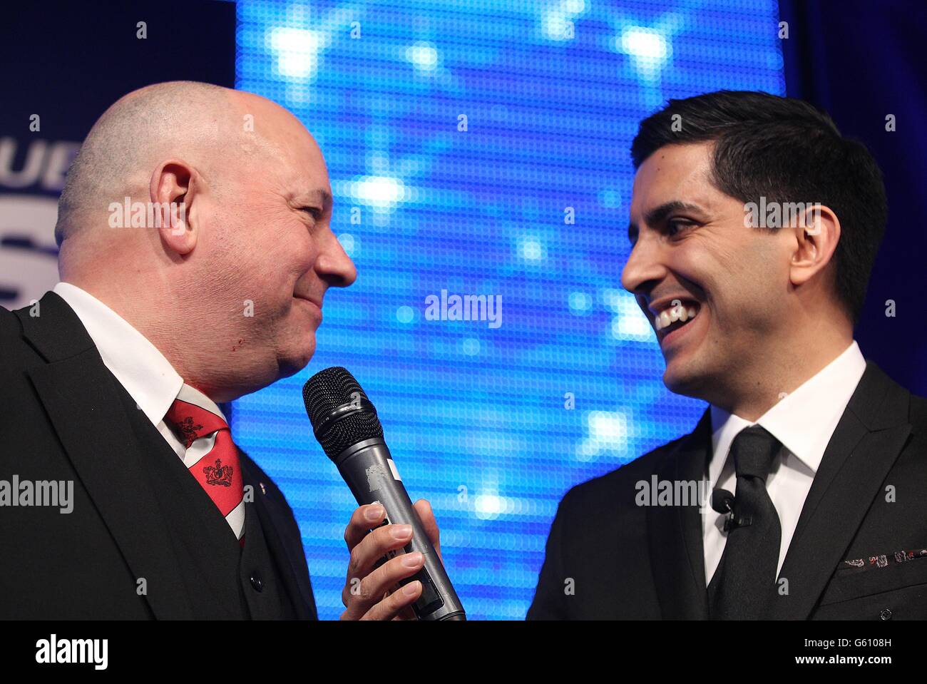 Exeter City fan Neil Le Milliere (left) is interviewed by BBC TV ...