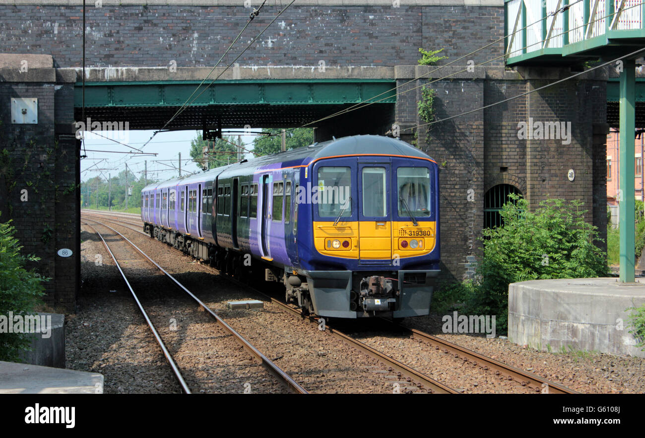 An electric passenger train run by “Northern” arrives at Euxton Balshaw ...