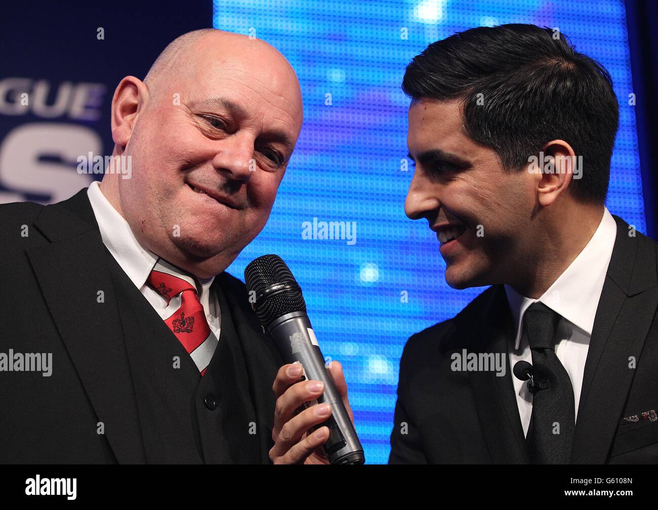 Exeter City fan Neil Le Milliere (left) is interviewed by BBC TV ...