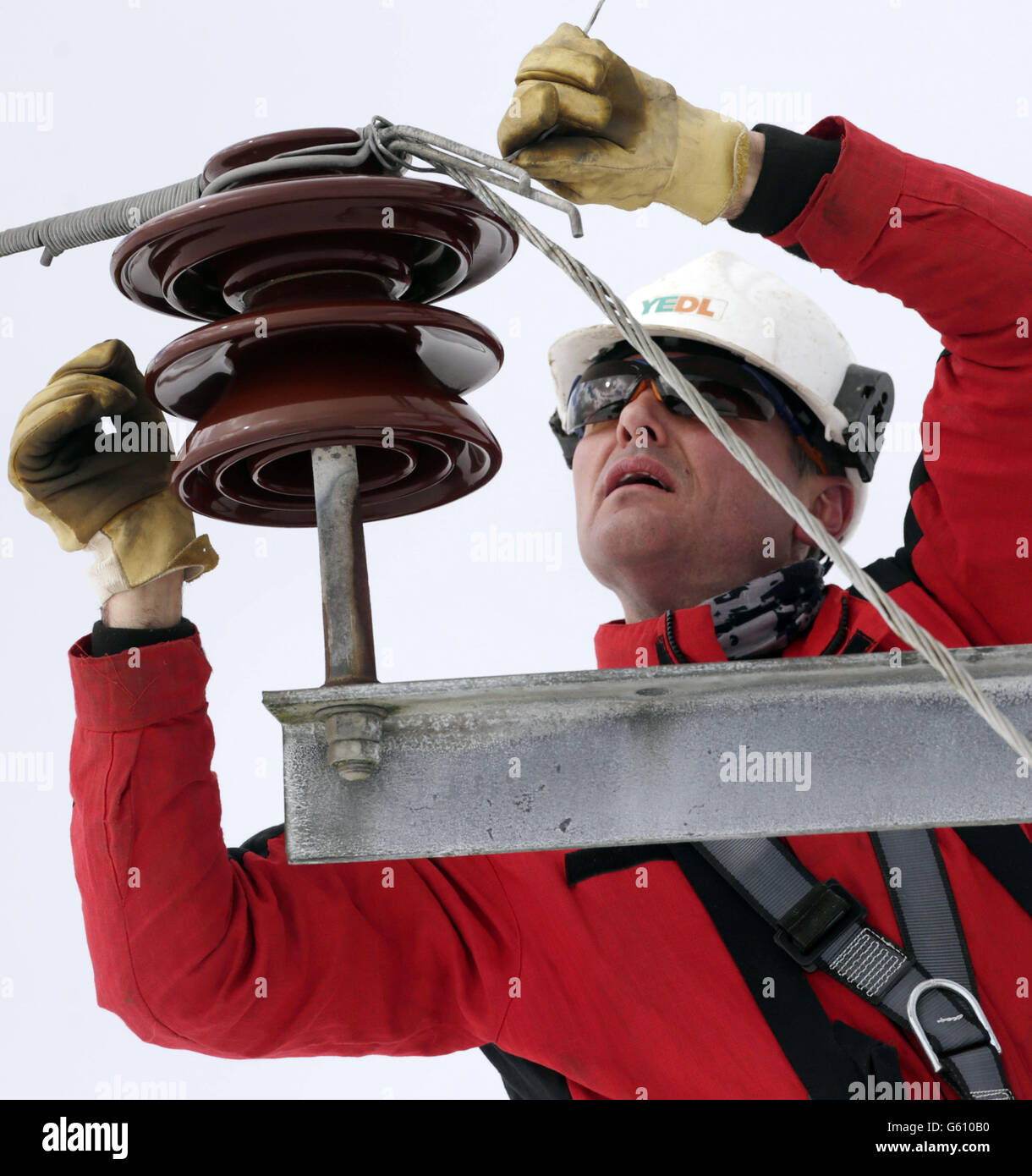 Workers fix a power line in Kintyre in Scotland as communities face a ...