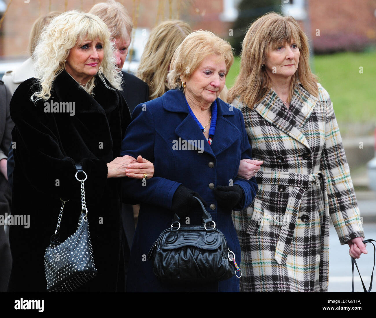 Lucy Collier (centre) widow of comedian Norman Collier arrives for his ...