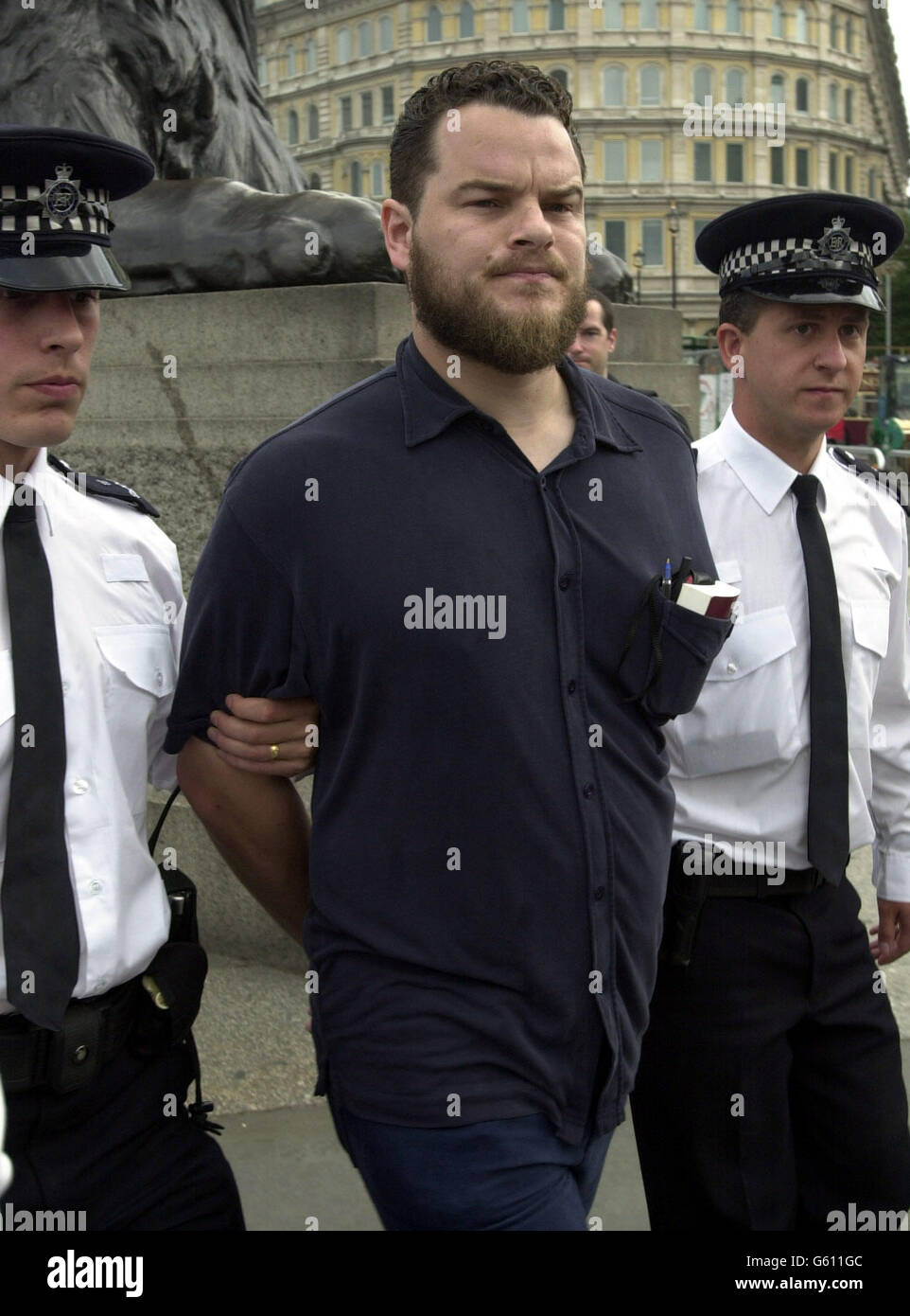 Police officers detain Sulayman Keeler after he addressed a Muslim Al ...
