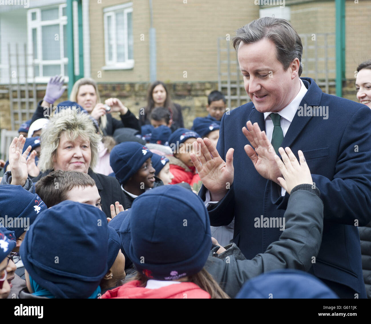 Prime Minister David Cameron, meets children during a visit to ...