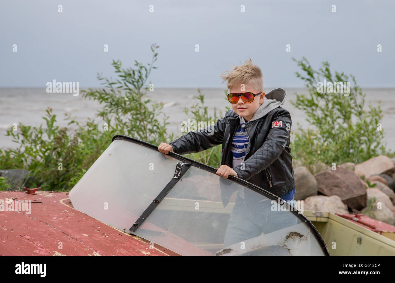 Boy in a small boat hi-res stock photography and images - Alamy