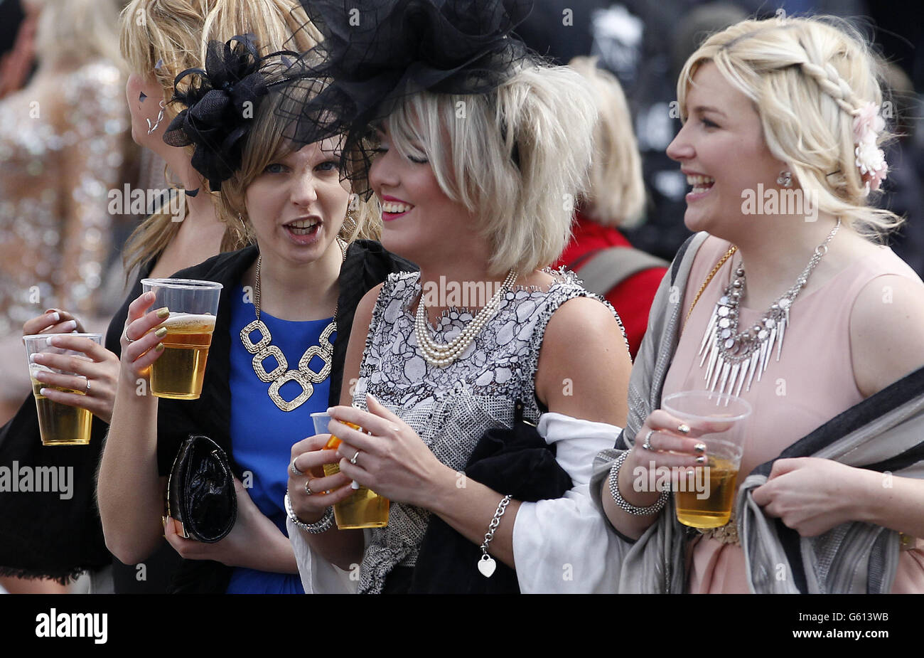Female racegoers arrive at Aintree during Ladies Day at the 2013 John ...