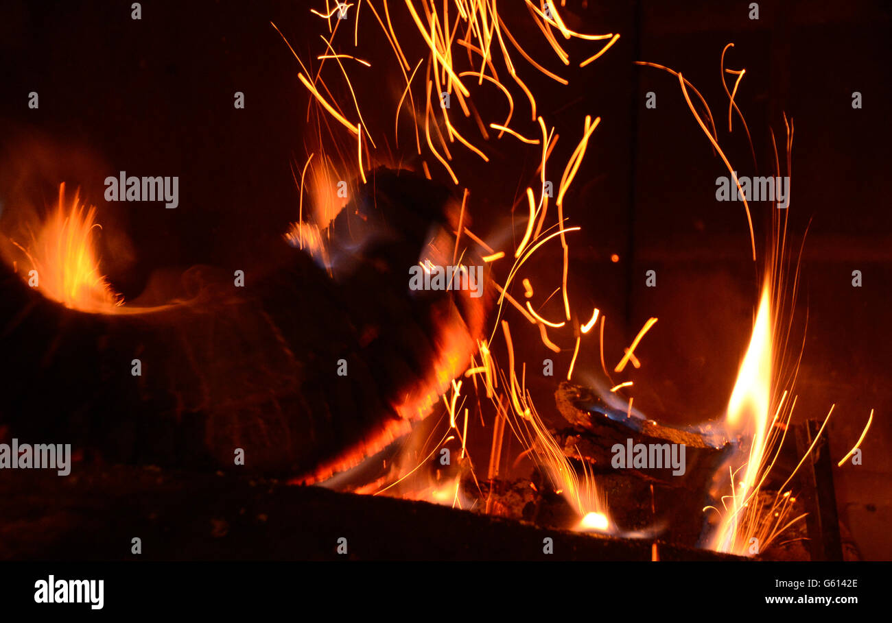 Log with flames in fireplace Stock Photo - Alamy