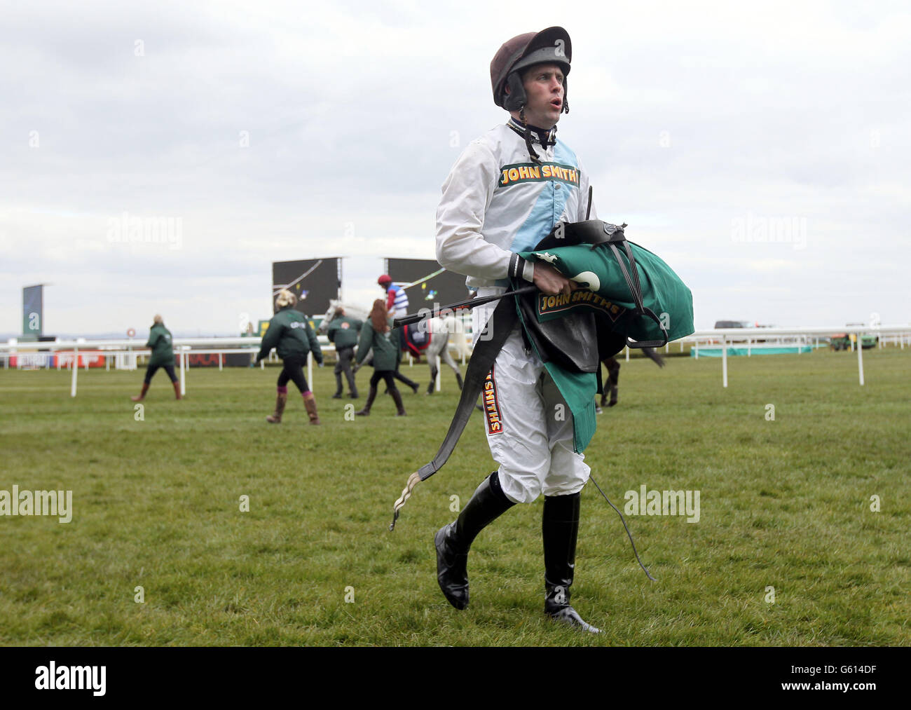 Jockey Martin Ferris makes his way in after the John Smith's Topham ...