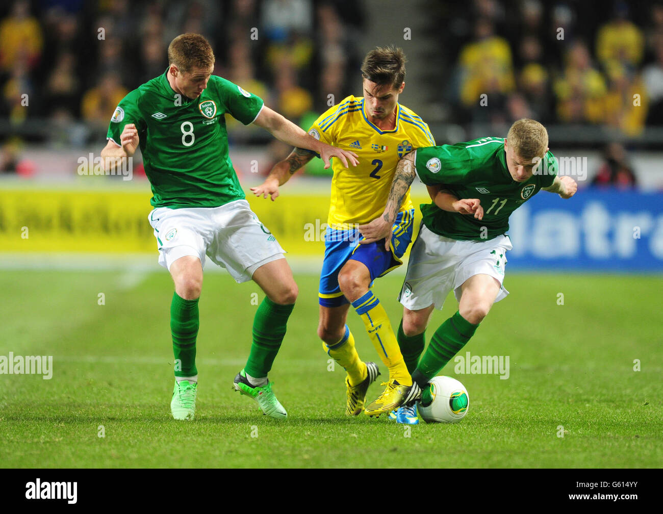Sweden's Mikael Lustig is stopped by Republic of Ireland's James ...