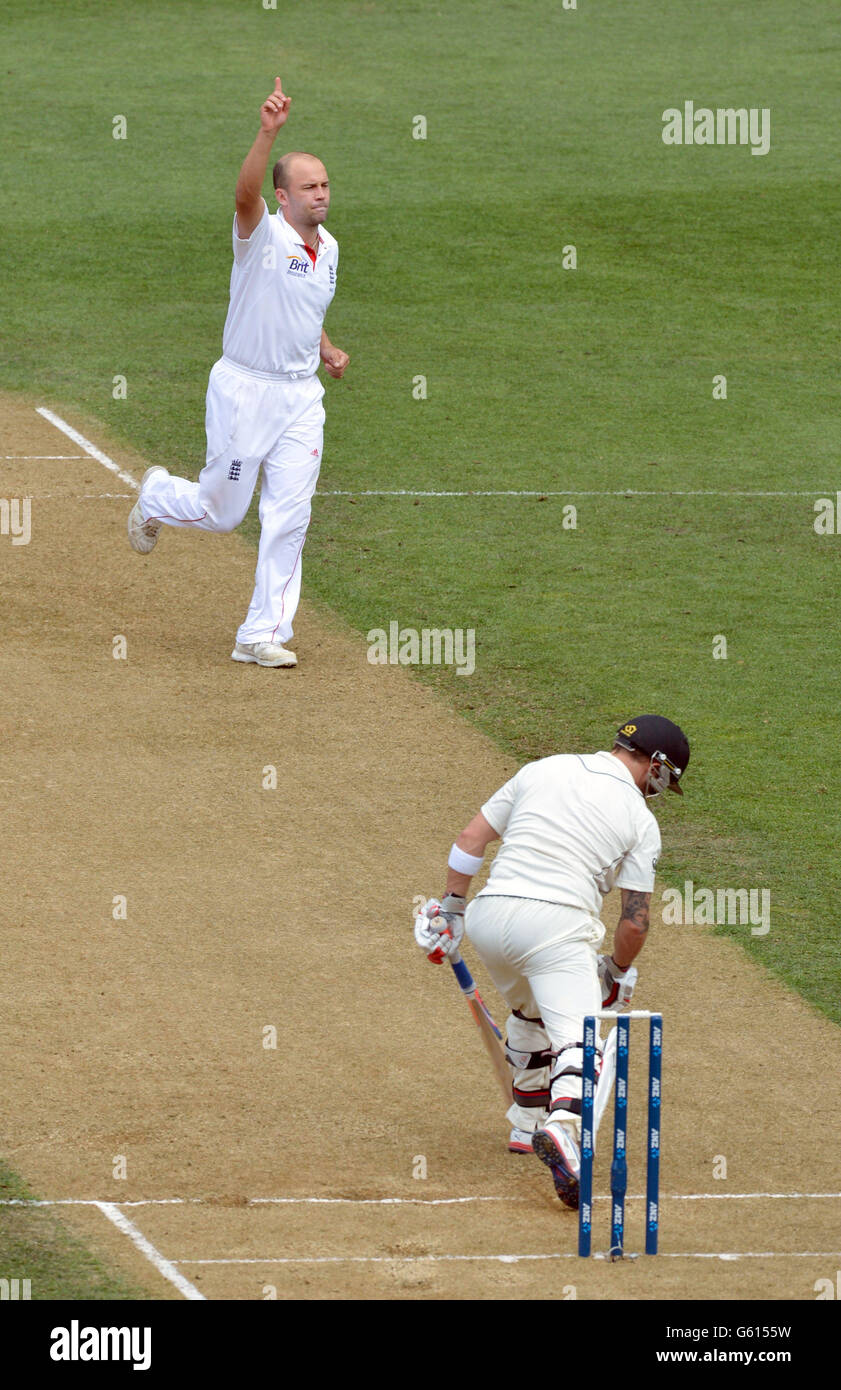 England's Jonathan Trott (top) takes the wicket of New Zealand's ...