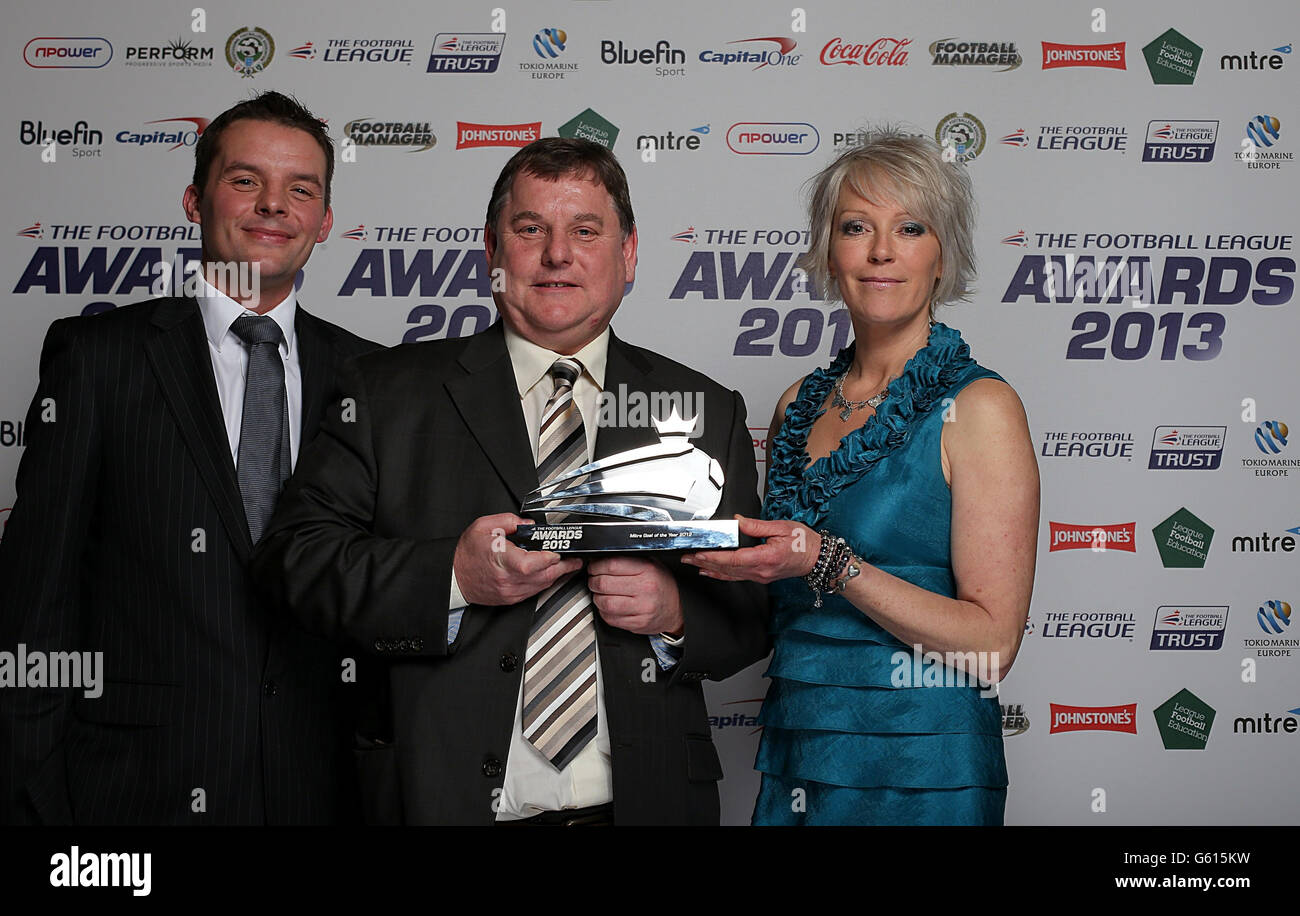David Cox (centre) collects the Mitre Goal of the Year award on behalf ...