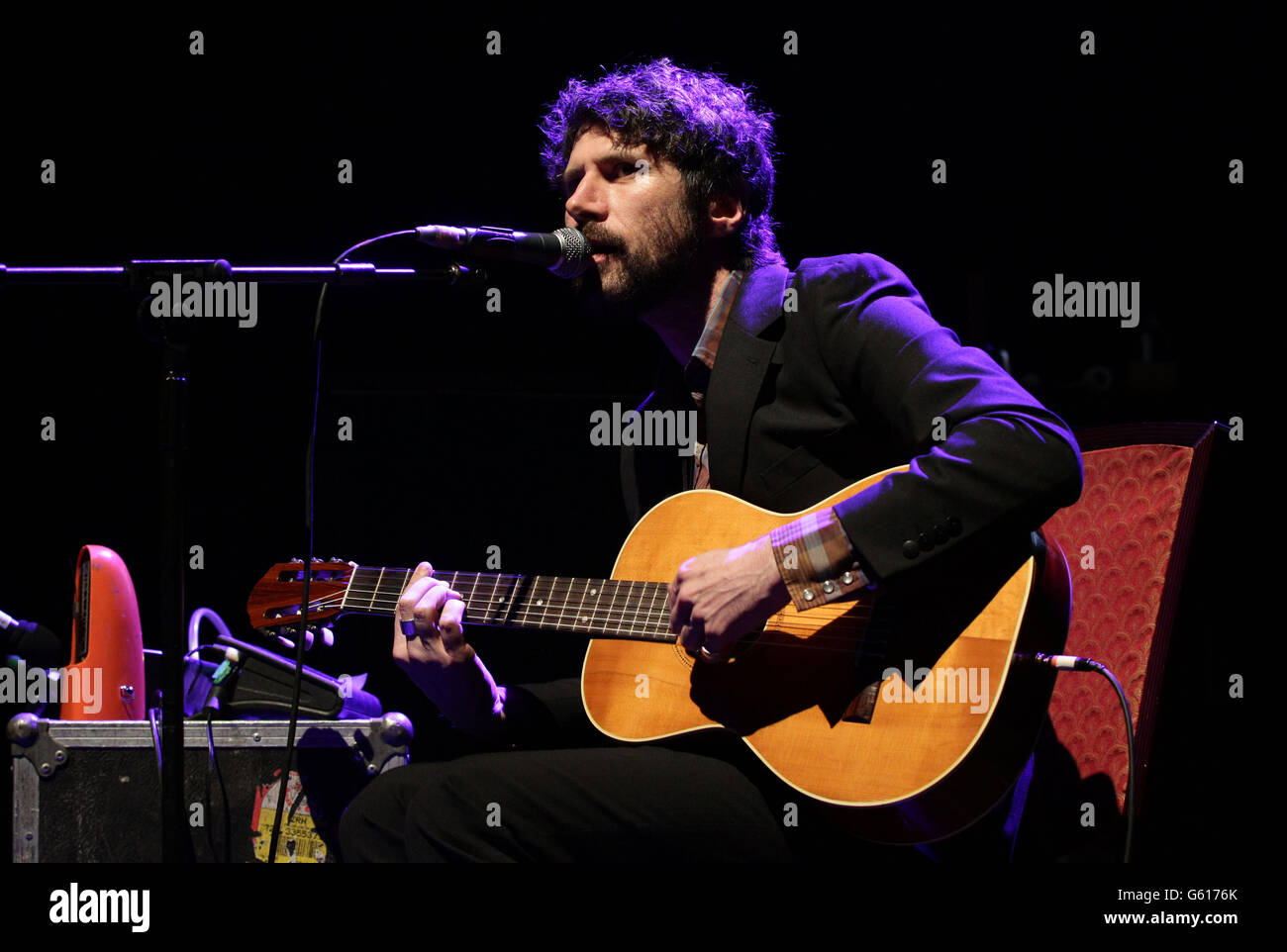 Gruff Rhys performing on stage during their Teenage Cancer Trust gig ...