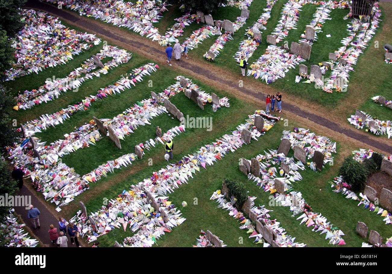Flowers left by the public in the graveyard of St Andrew's Church in ...