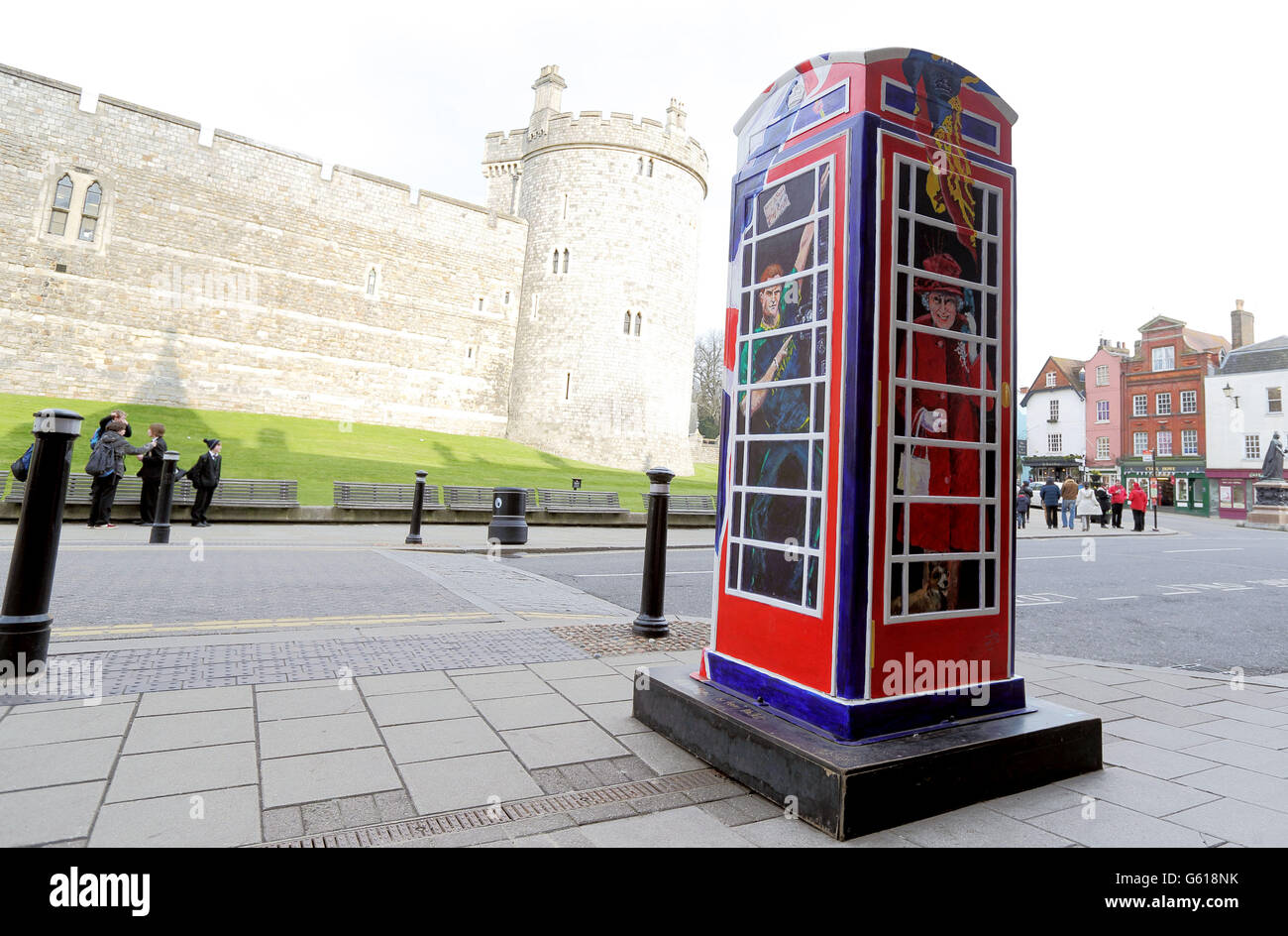 A phone box with images of Queen Elizabeth II, Prince Harry and the ...