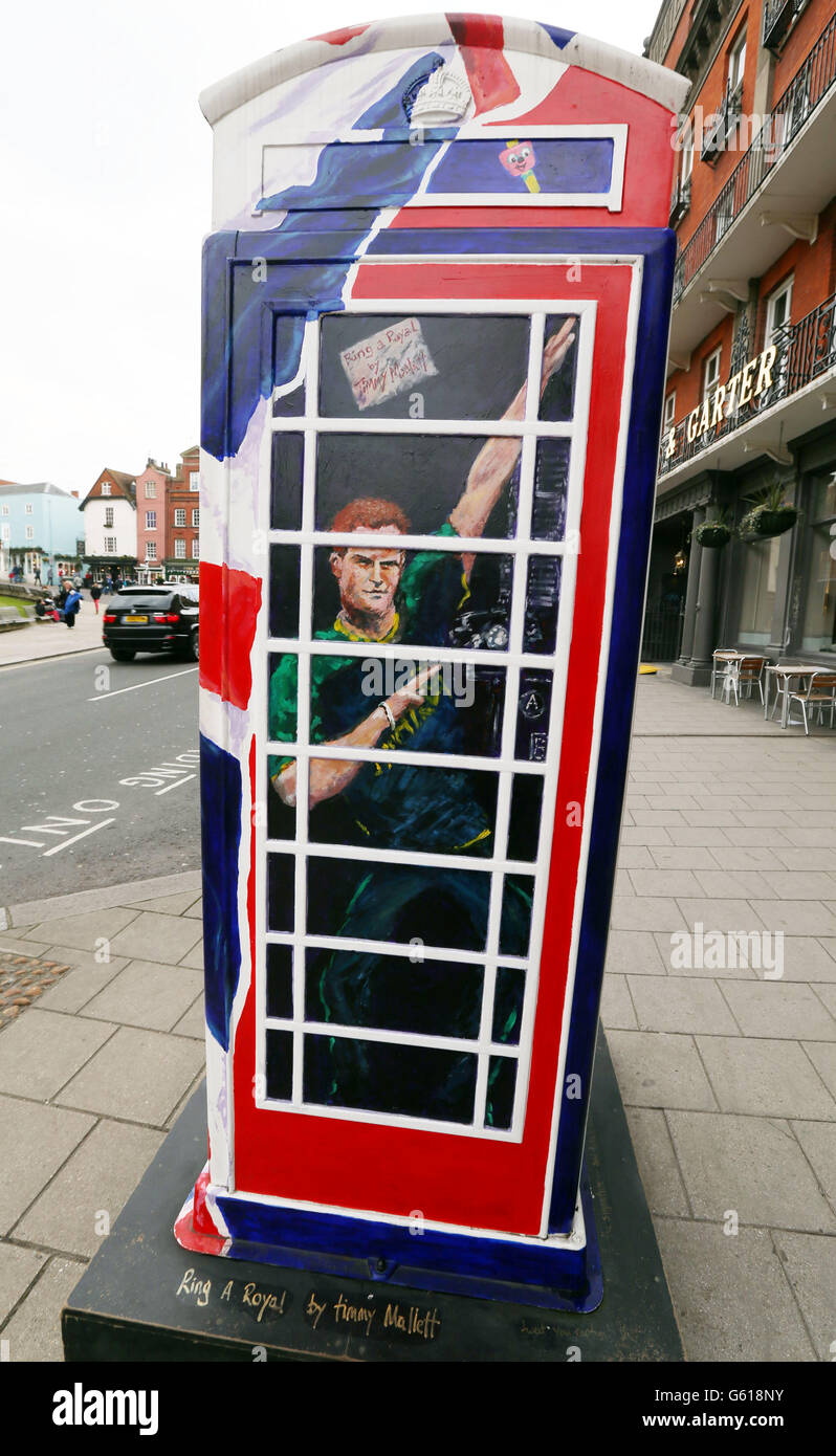 A phone box with images of Queen Elizabeth II, Prince Harry and the ...