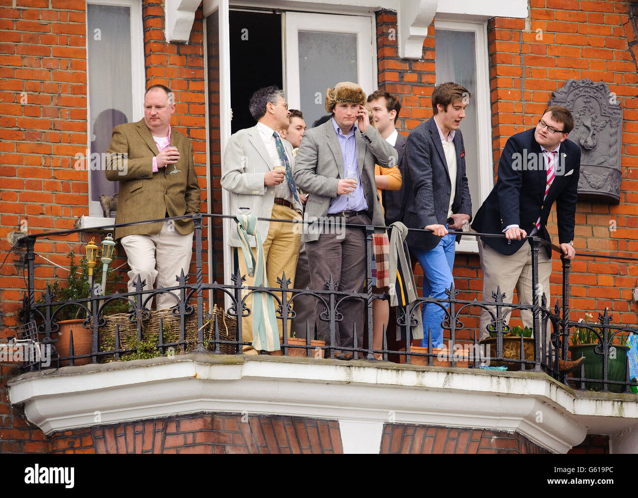 Spectators watch the 159th Boat Race on the River Thames, London Stock ...