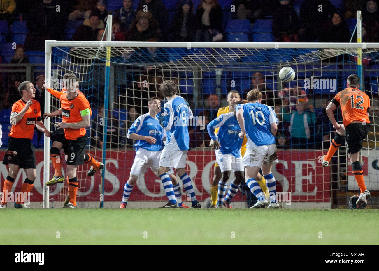 St Johnstone's Liam Craig heads in the equalising goal against Dundee ...
