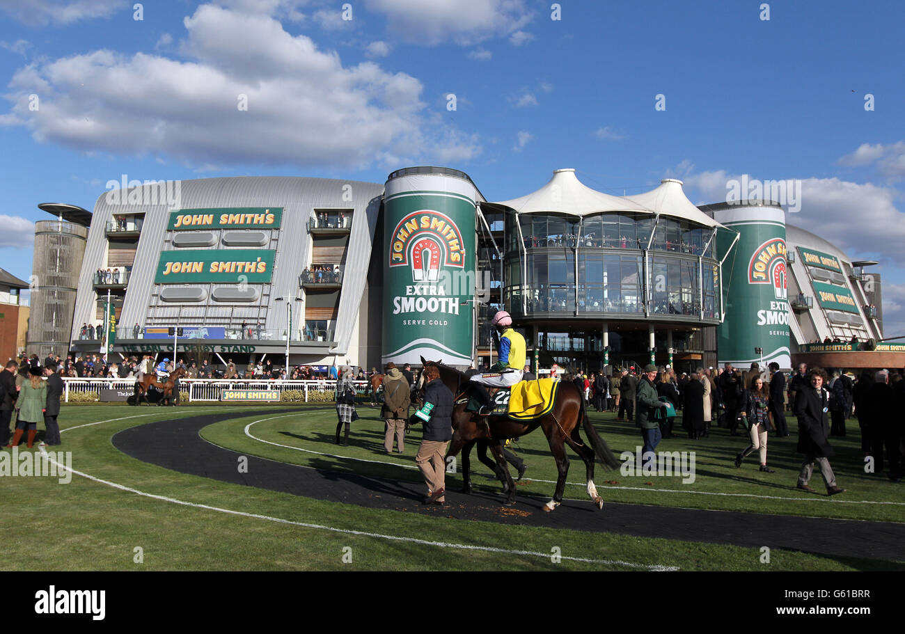 Horses leave the parade ring for the Silver Cross Handicap Hurdle ...