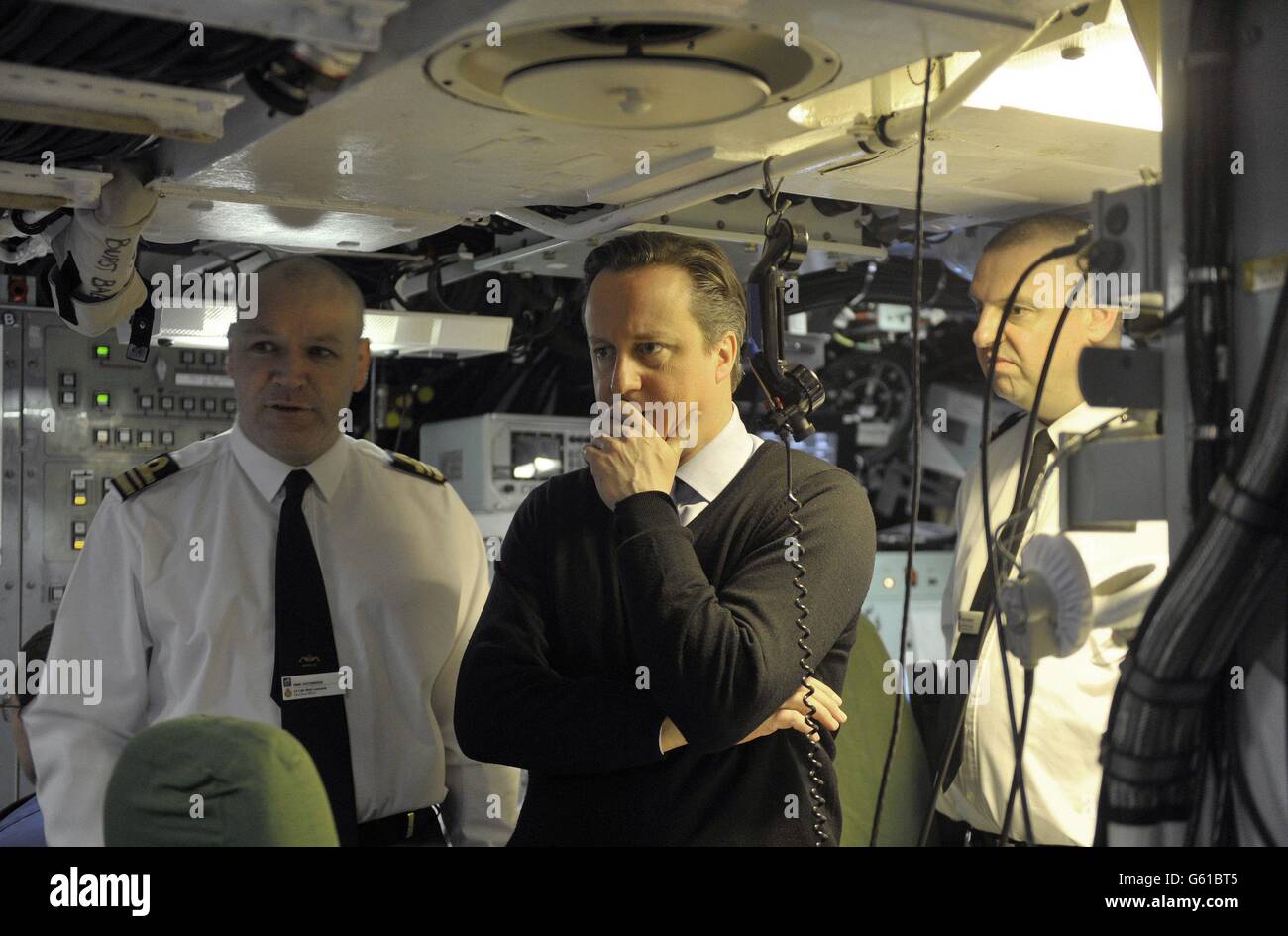 Prime Minister David Cameron with Commander John Livesey RN (right ...