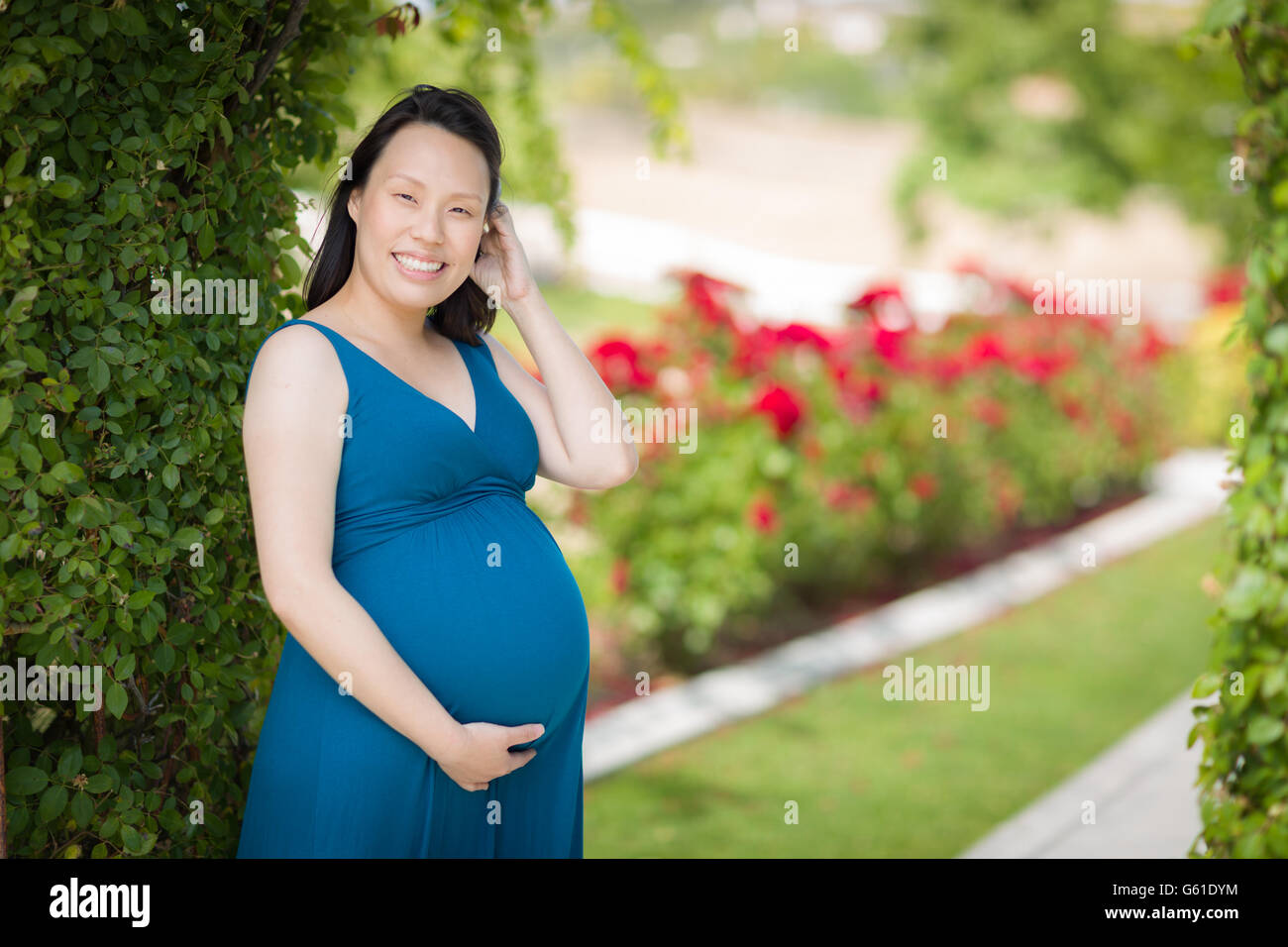 Portrait of Happy Young Pregnant Chinese Woman in the Park Stock Photo ...