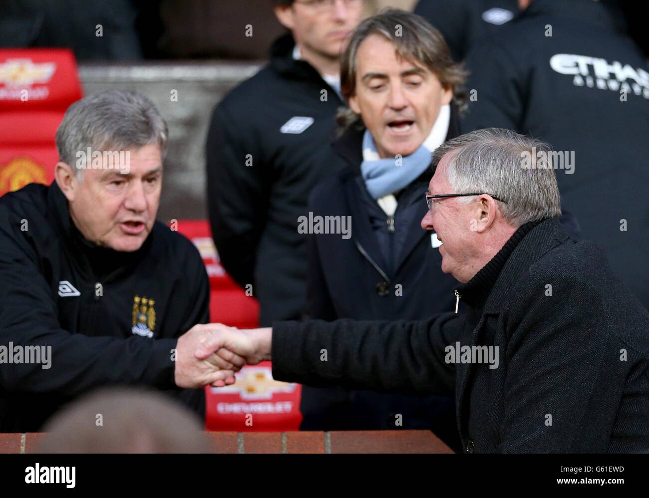 Manchester City manager Roberto Mancini (centre) and assisntant Brian ...