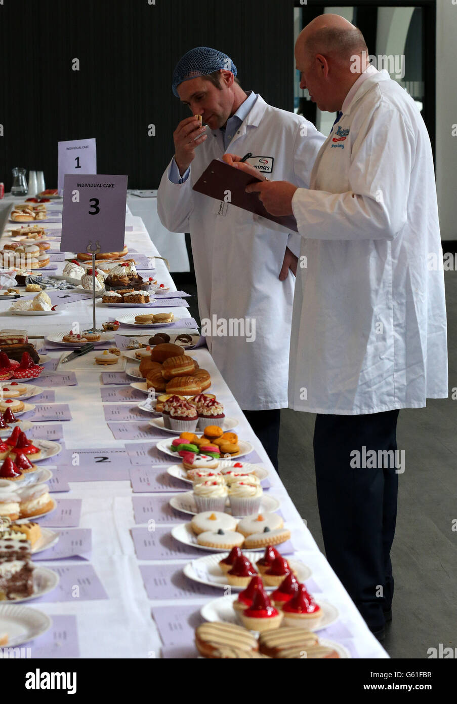 Judge Douglas McCabe smells a cake during judging for the Scottish ...