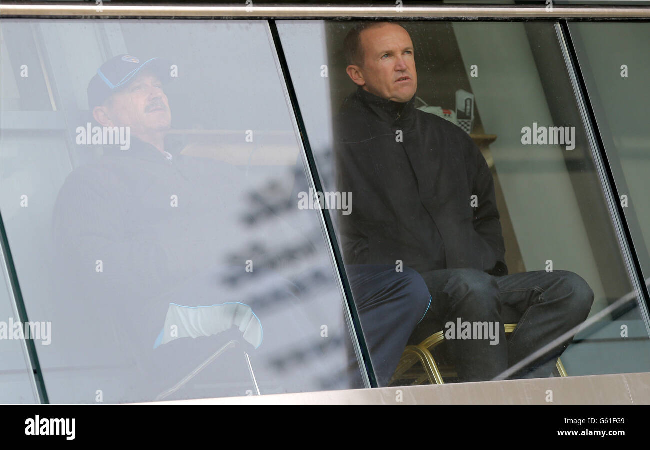 England coach Andy Flower in stand watches Warwickshire's Chris Wright ...