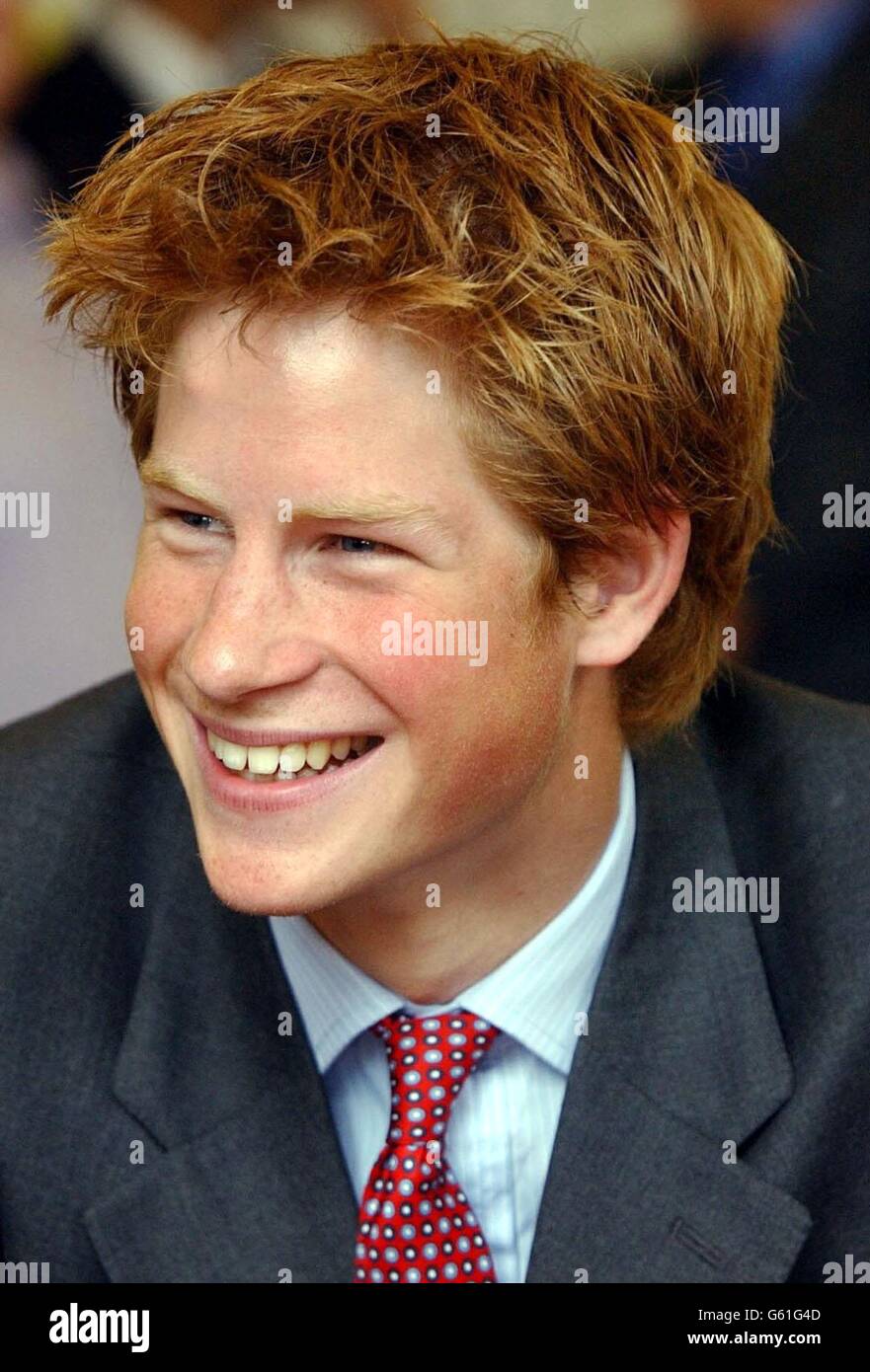 Prince Harry smiles during a visit to Osmani school in Whitechapel ...