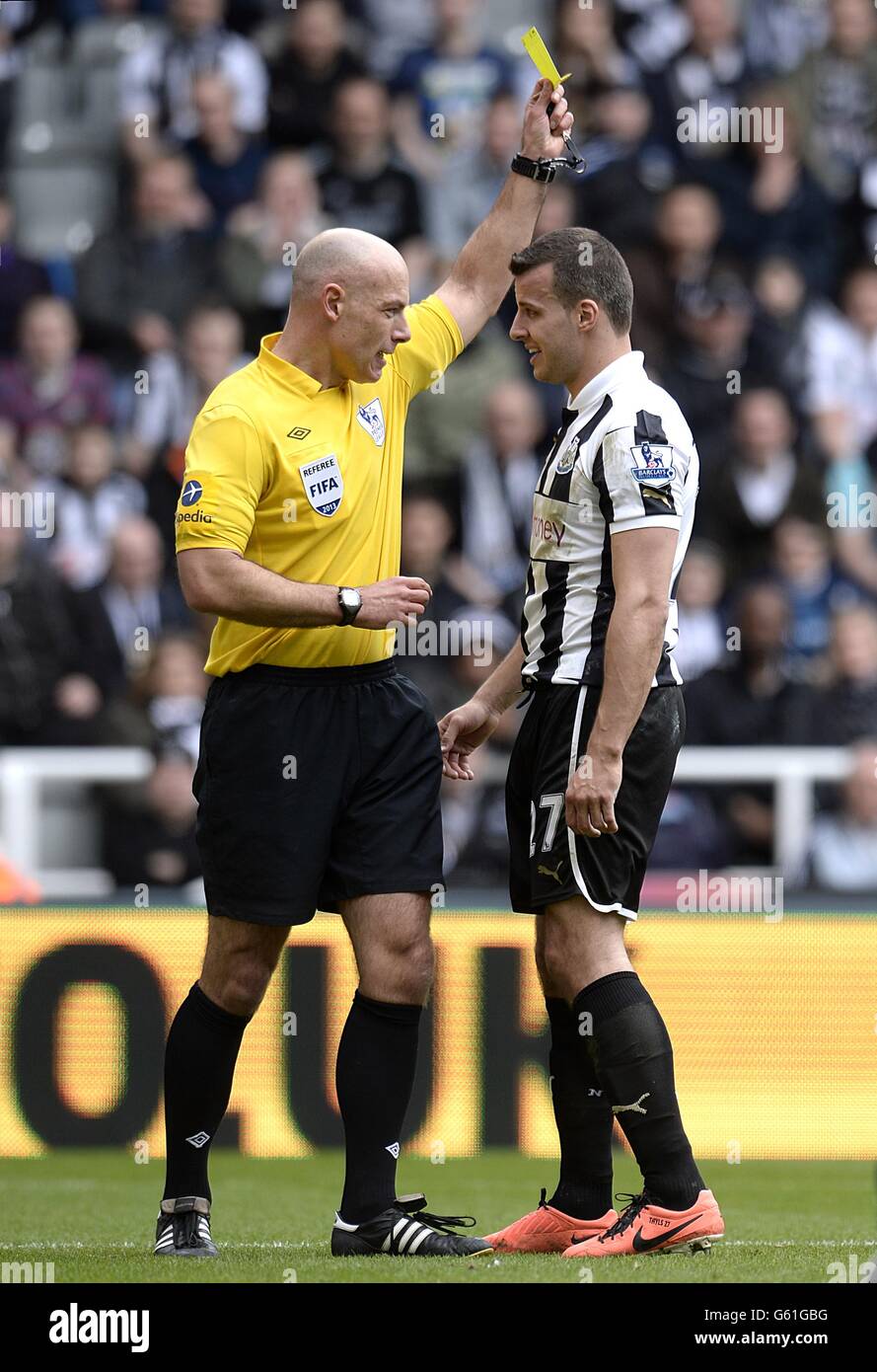 Newcastle United's Steven Taylor receives a yellow card from referee ...