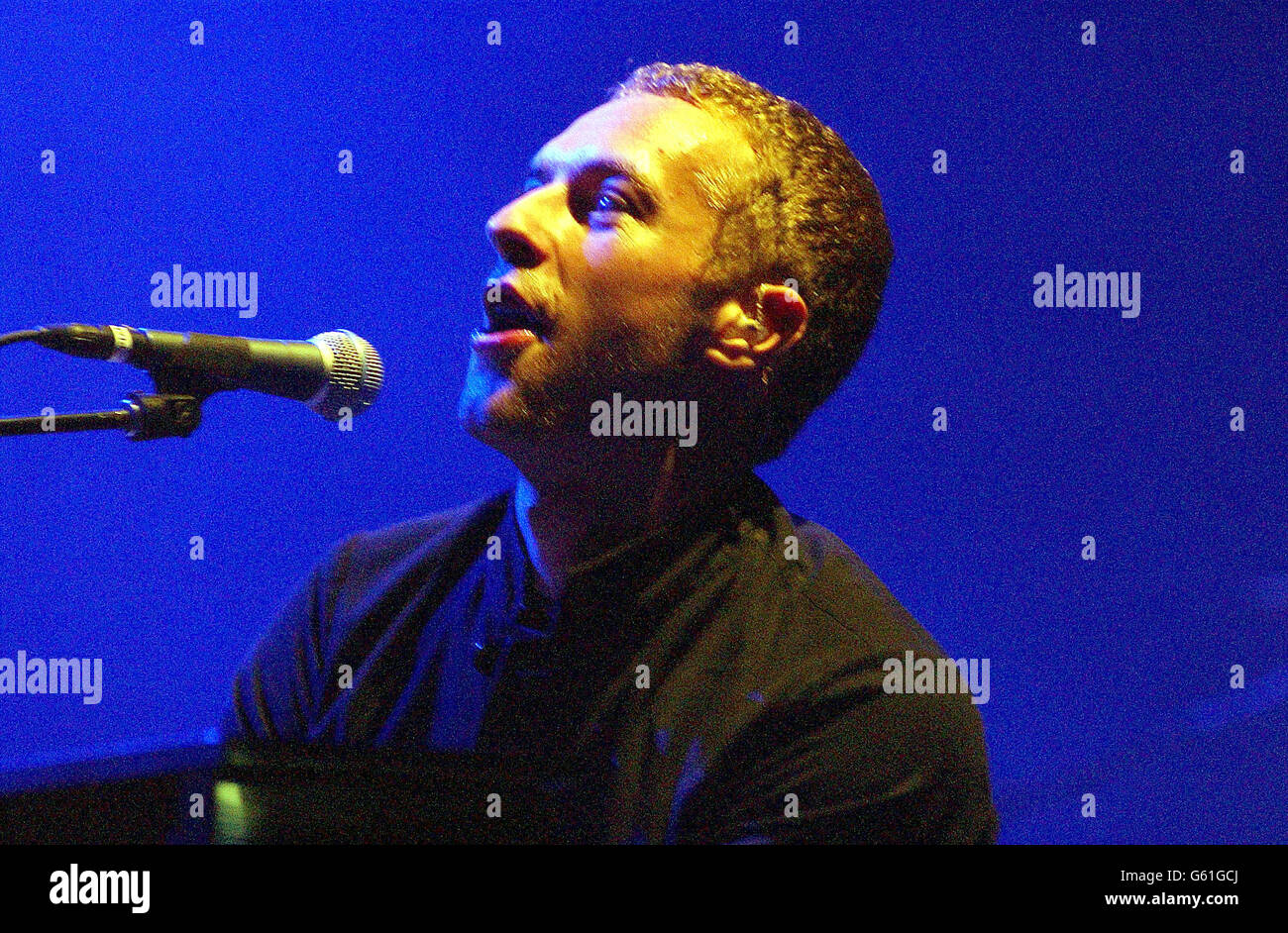 Lead singer of of Coldplay Chris Martin performing in concert at the ...