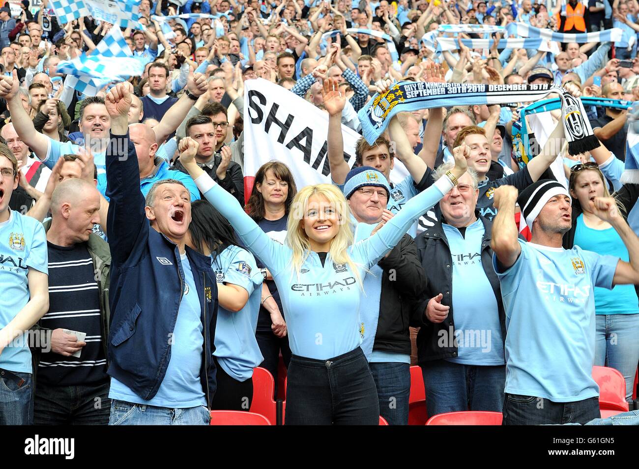 Manchester city fans show their passion in the stands hi-res stock ...