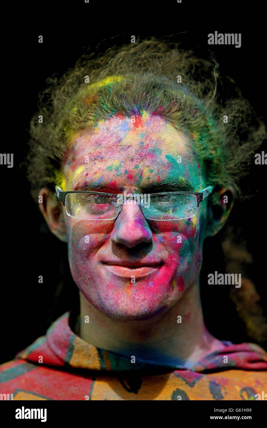 A partygoer covered in multicoloured chalk dust in central Dublin ...