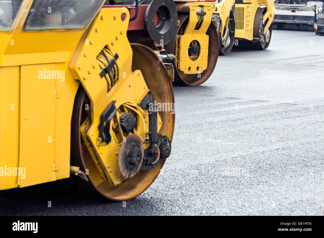 Large steam rollers paving a new asphalt road Stock Photo - Alamy