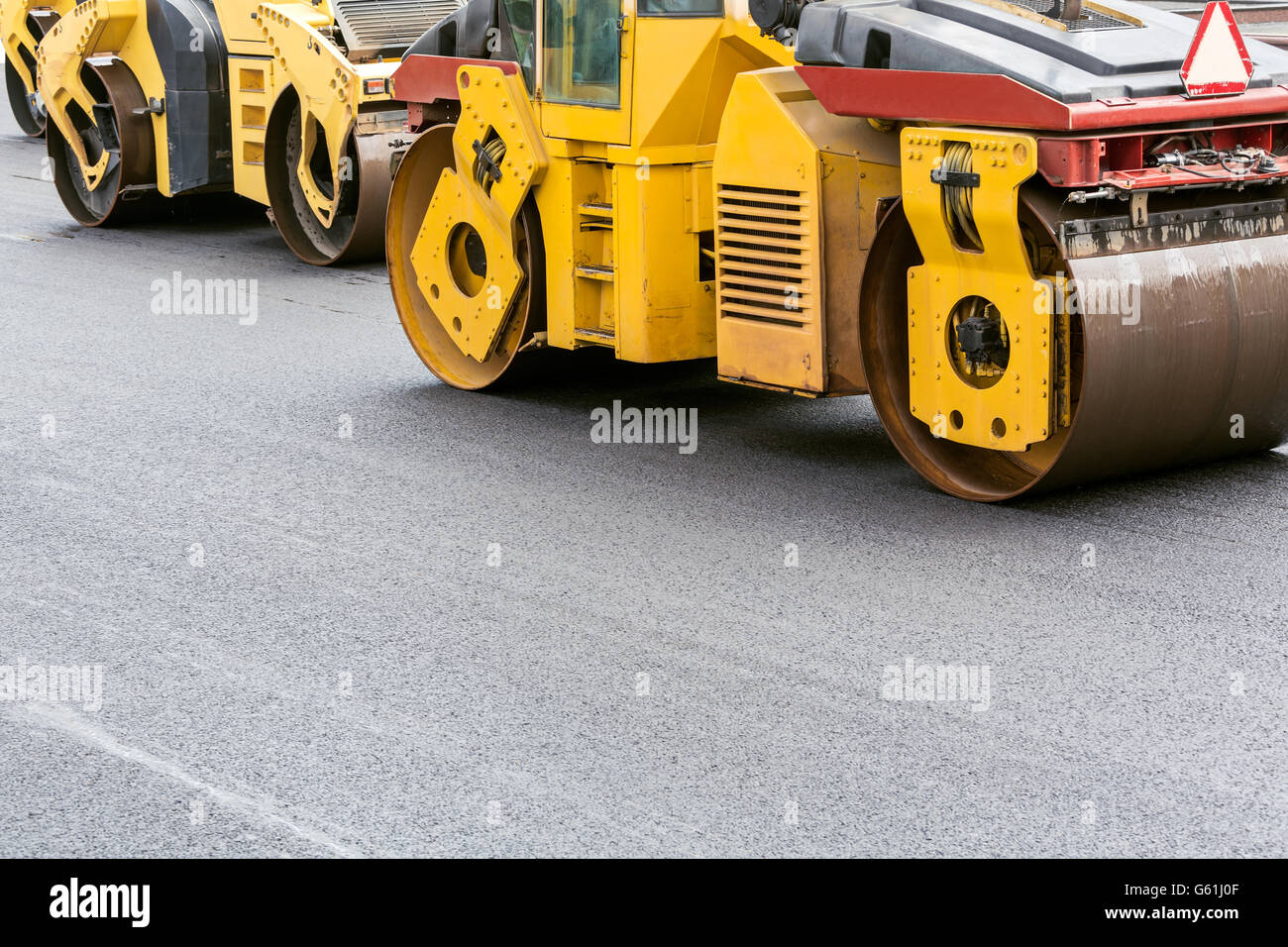 Heavy road machine during asphalt pavement works Stock Photo - Alamy